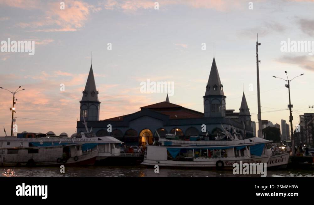 Boats moored in front of Ver o Peso Market building during sunset ...