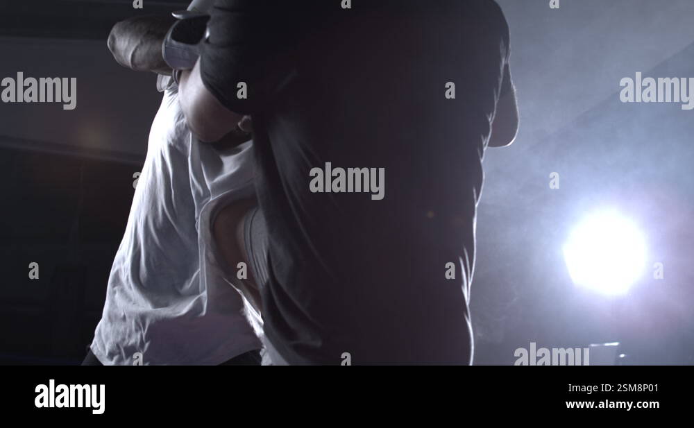 Fighter kicking opponent with knee kick in super slow-motion at 800 fps ...