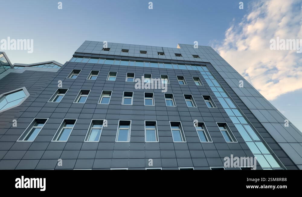 Modern factory office building, covered with metal building cladding ...