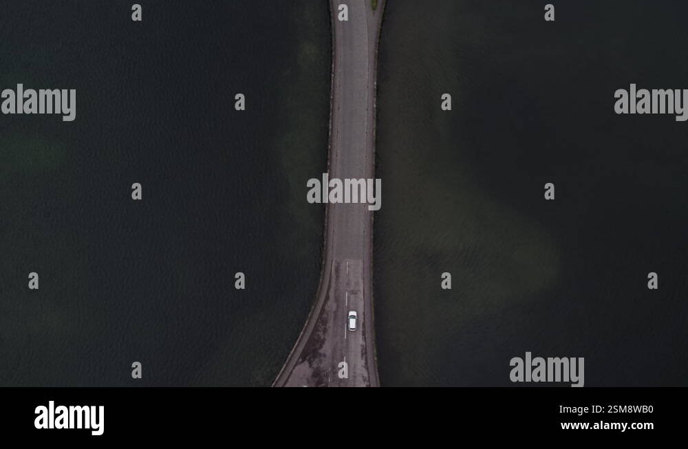 Car crossing Lagoa das Sete Cidades bridge, São Miguel island, Azores ...