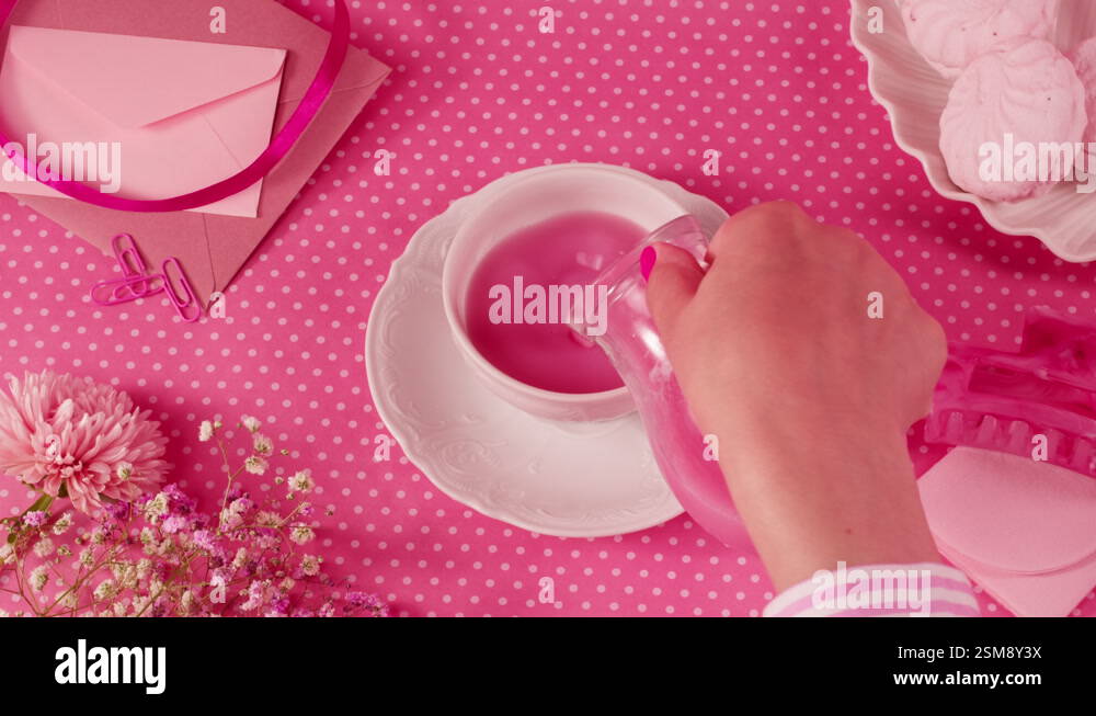 Pink background with cup of milk or tea, birthday barbie style table ...