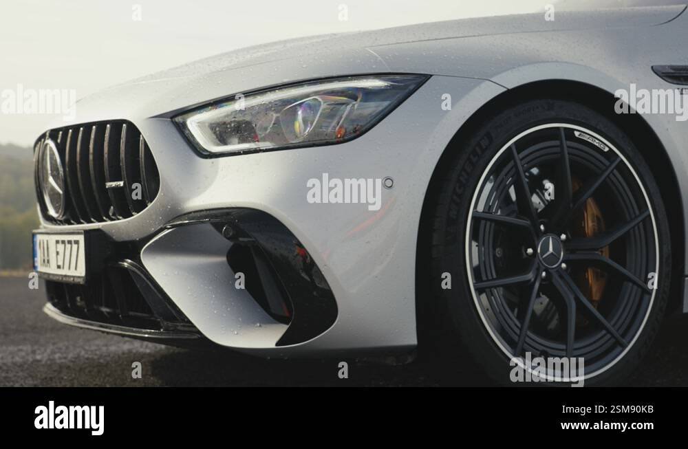 White Mercedes AMG GT 63S car front and side closeup view with sun ...