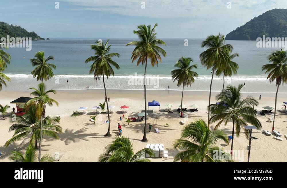 Maracas Bay Sign with view of the ocean and waves in the backgroound ...