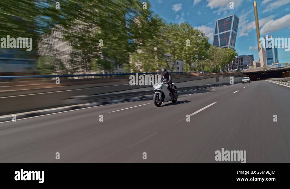 Rolling shot man riding supersport Ducati motorcycle on the street in ...