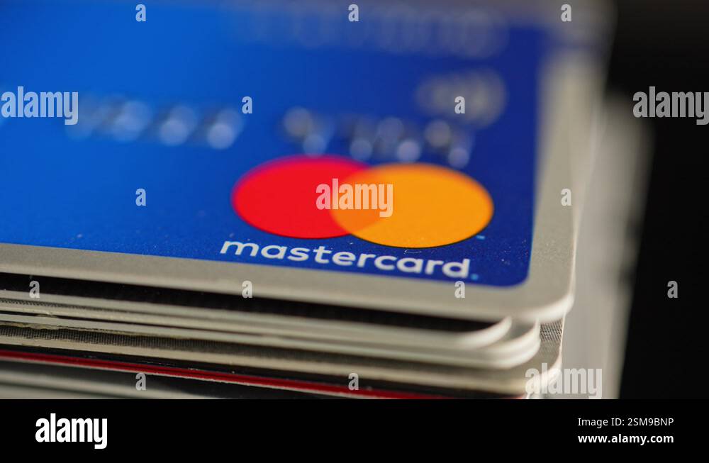 Mastercard credit card symbol on the table. Pile of Visa and Mastercard ...