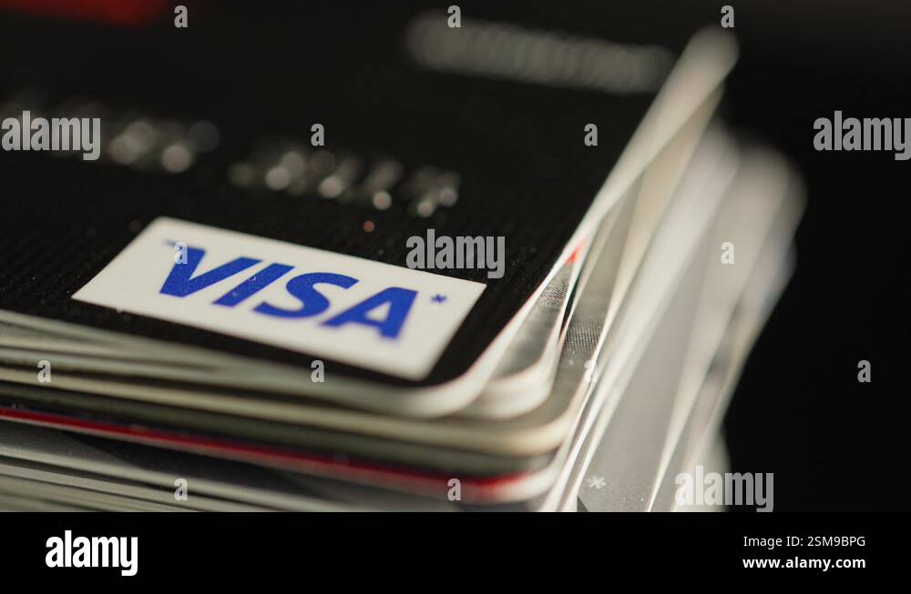 Visa credit card symbol on the table. Pile of Visa and Mastercard cards ...
