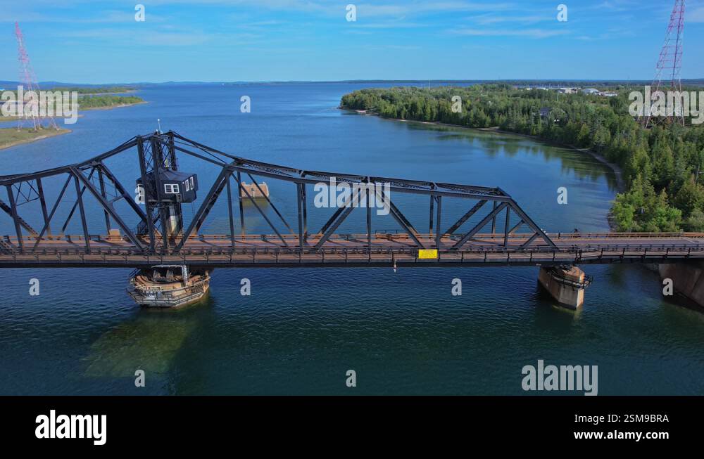 Little current swing bridge at sunny summer with blue sky. The bridge ...