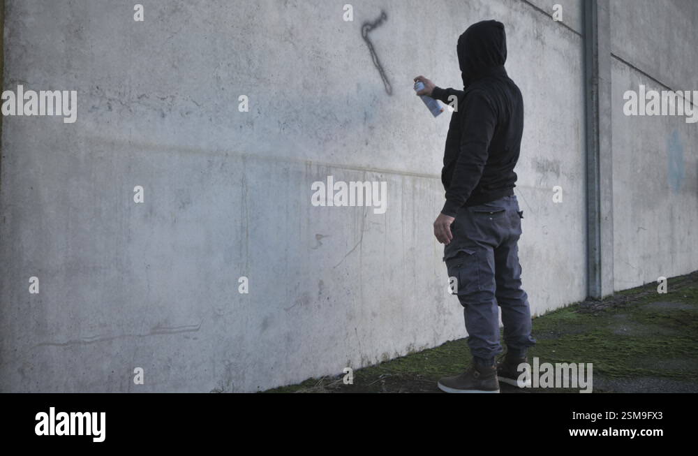 person drawing painting nazism symbol swastika on the wall Stock Video ...