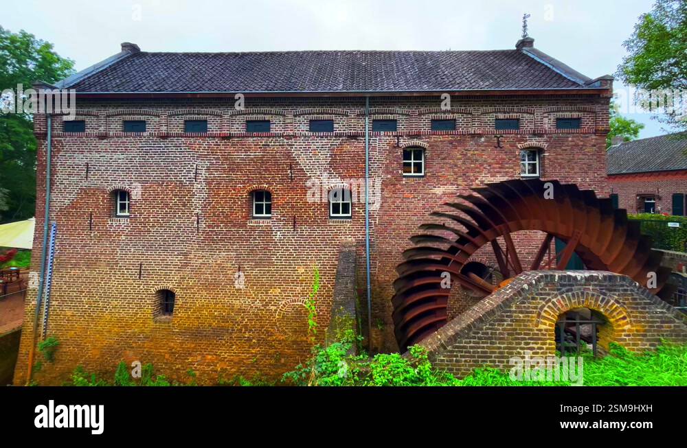 Famous historic water mill turning around at Arcen medieval castle ...