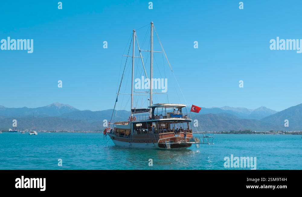 Luxury yacht berth to tropical bay Stock Video Footage - Alamy