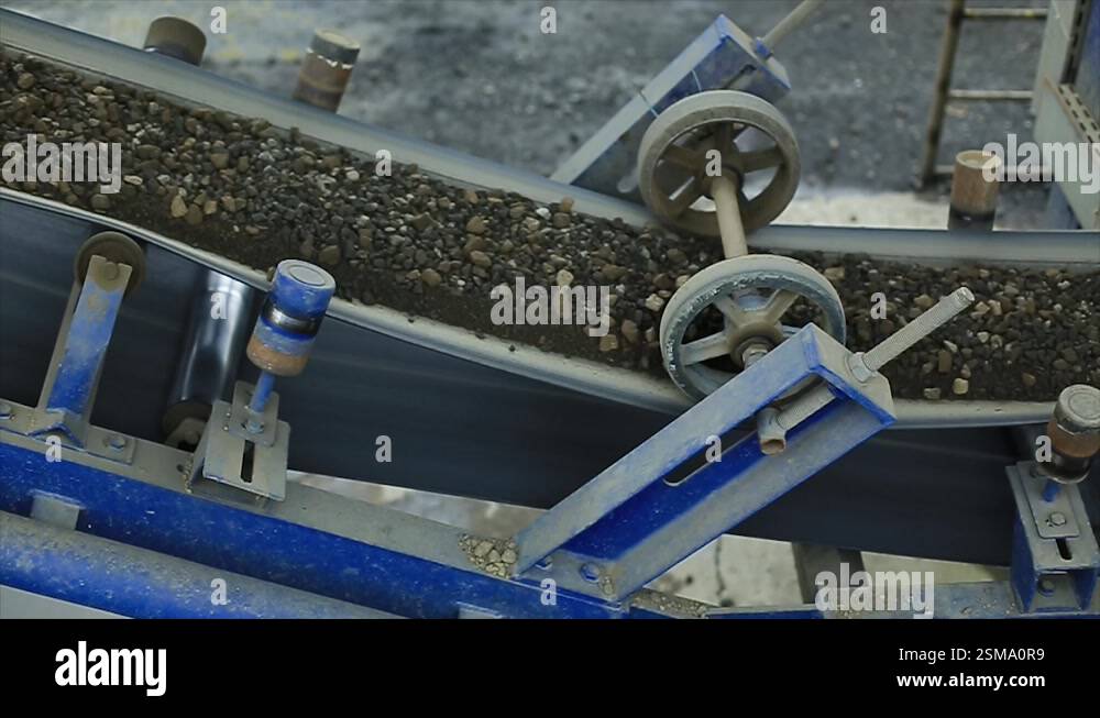 Feeder supplies aggregate from the cold bin to the dryer via a conveyor ...