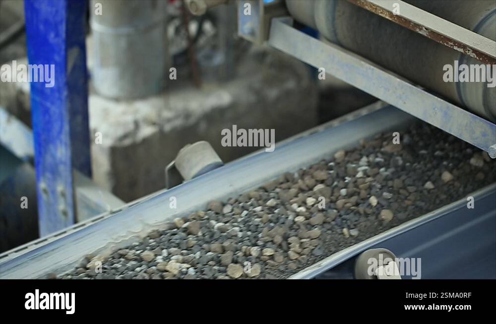 Feeder supplies aggregate from the cold bin to the dryer via a conveyor ...