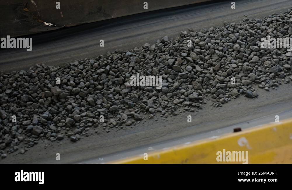 Feeder supplies aggregate from the cold bin to the dryer via a conveyor ...