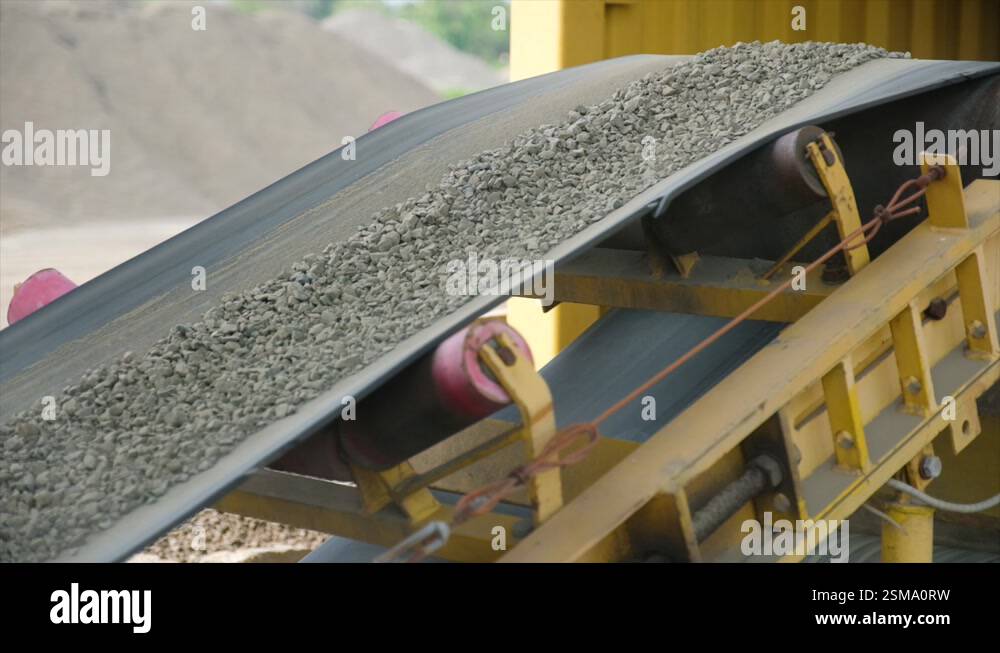Feeder supplies aggregate from the cold bin to the dryer via a conveyor ...