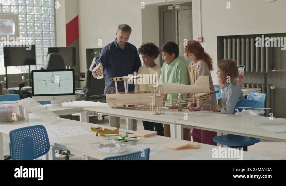 Teacher Showing Wood Airplane Construction Model to Kids in Classroom ...