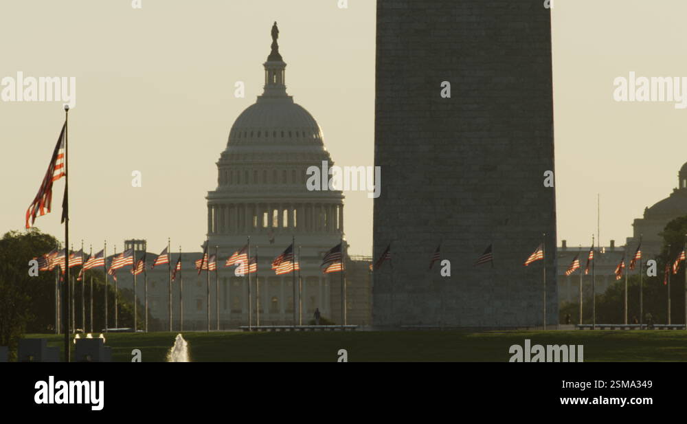 Flags Wave in Slow Motion at the Base of the Washington Monument with ...