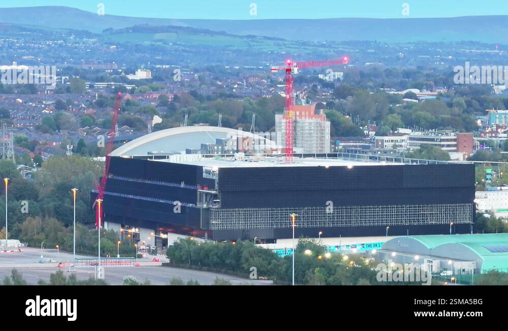 Co-op Live Tilt up drone shot of buildings in Manchester City in the ...