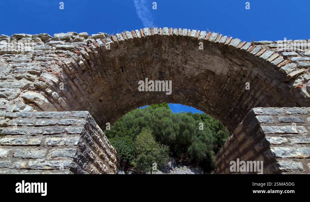 Stone arch of amphitheater of Butrint and Stairs of a Bygone Stage ...