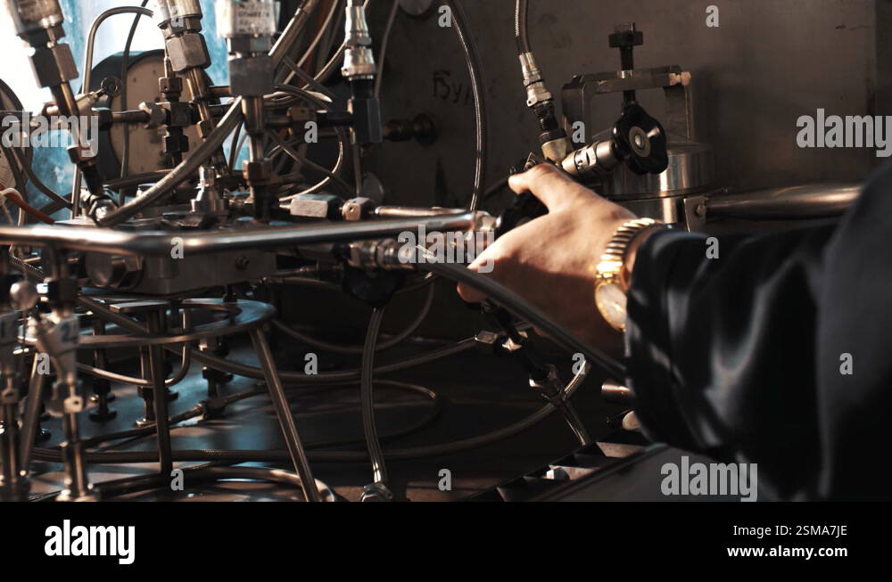 Male factory worker hands in process of turbine asembly close-up. Man ...