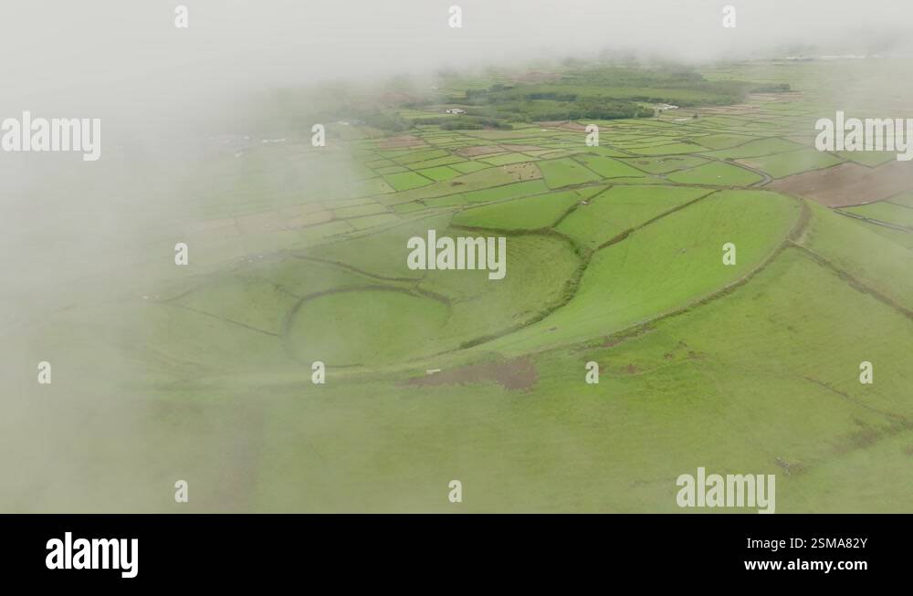 Fly over the green volcanic peak. Old volcano with green grass fields ...