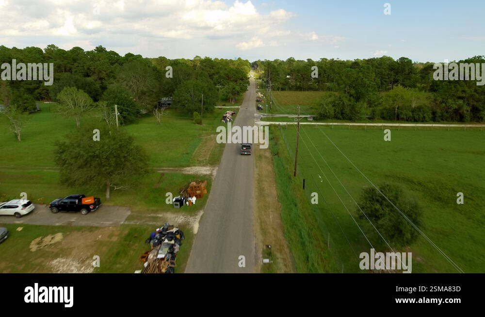 Aerial Forward Shot Of Pickup Car Moving Between Green Landscapes ...