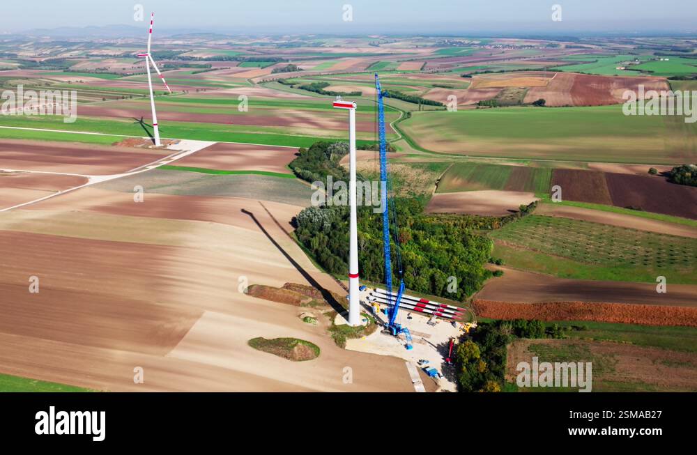Installing A Wind Turbine In The Wind Farm - aerial pullback Stock ...
