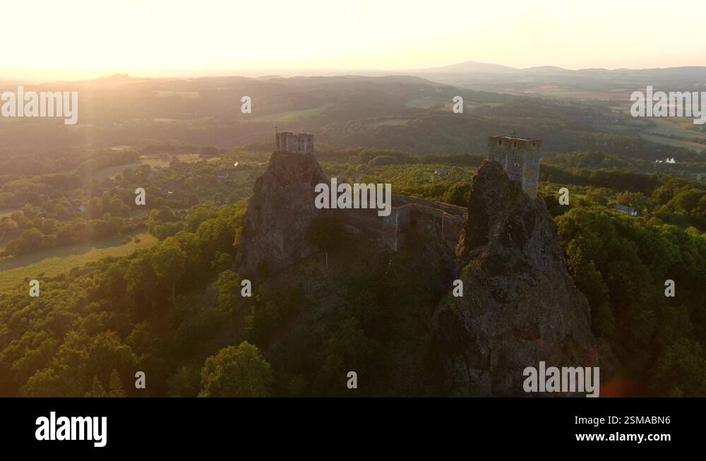 Trosky Castle aka Hrad Trosky aerial orbit sunset view. Bohemian ...