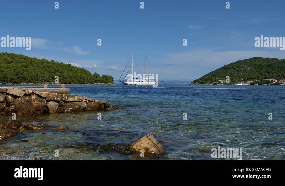 Calm waterfront sea view with sailing boat, Southern Europe Stock Video ...
