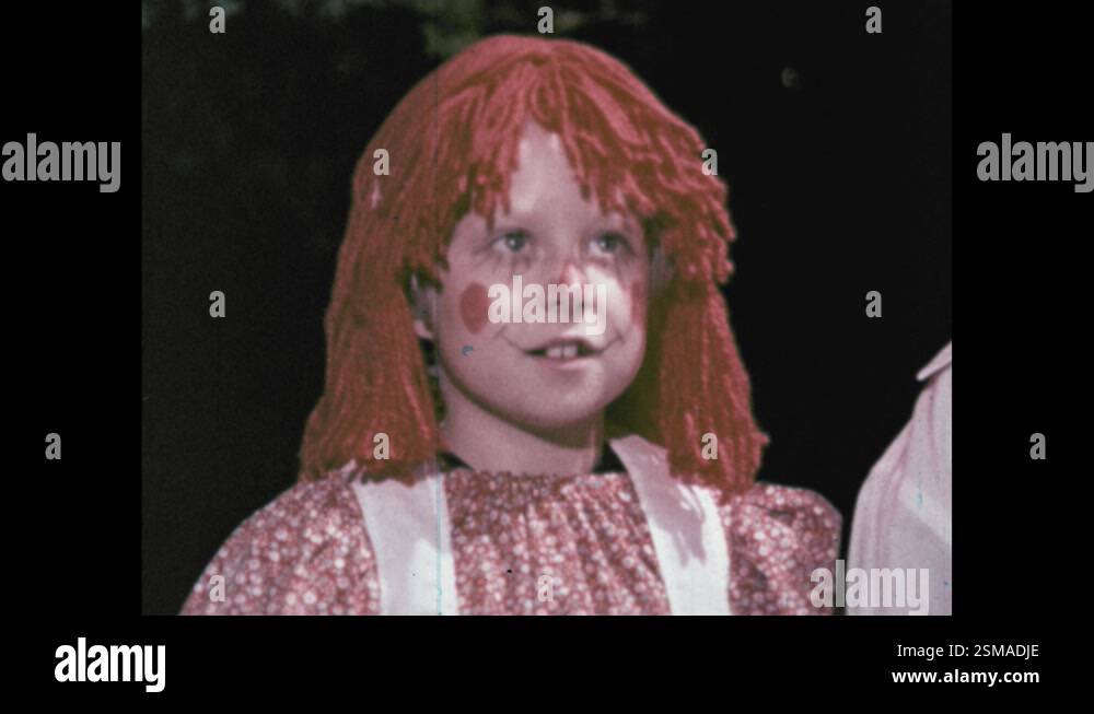 1970s: Kids in costume telling jokes for candy. Smiling woman. Children ...