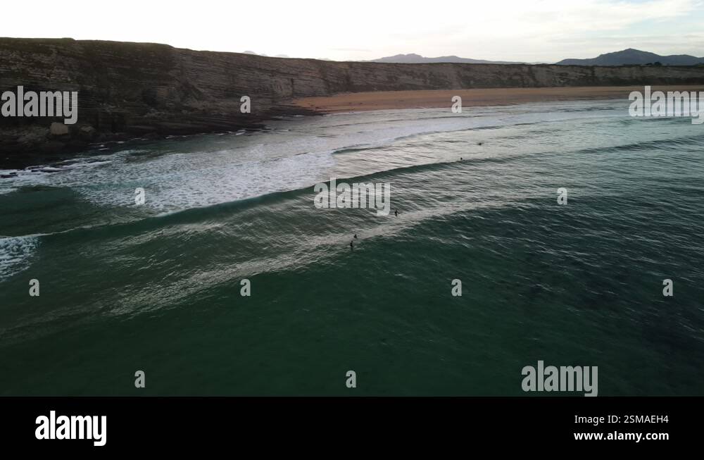 Group of surfers waiting for surfing waves to come at oceancliff shore ...