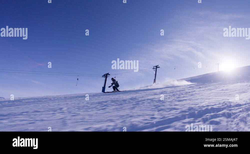 Experienced male skier skiing on slopes on a ski center. Recorded at ...
