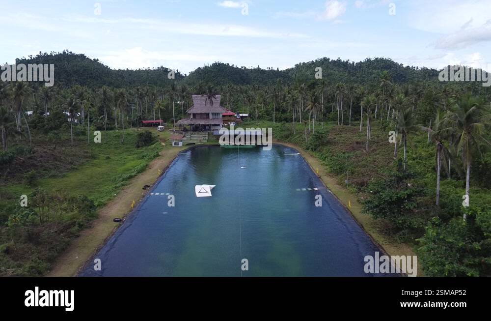 Cable wake park of Siargao with Artificial Wakeboarding Lake amid hills ...