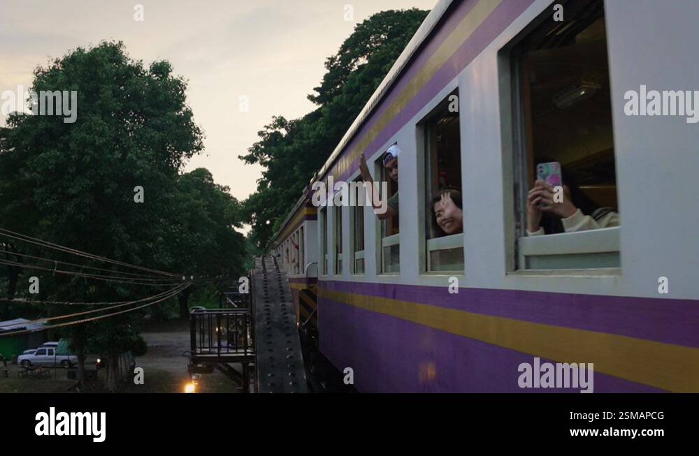 Train going past camera on Burma Railway or Death Railway in Thailand ...