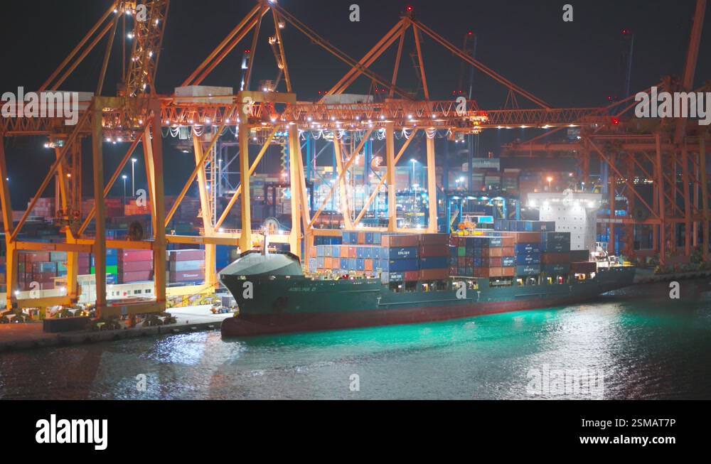 4k, panoramic aerial night view, Port cranes and many containers in the ...