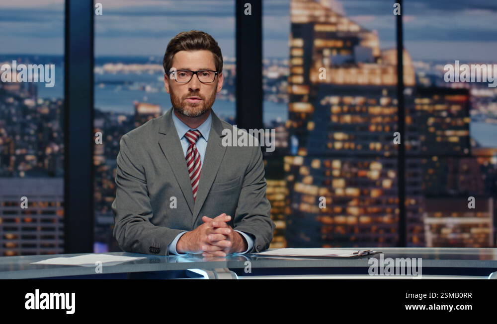 Serious newsreader speaking newscast evening studio closeup. Man ...