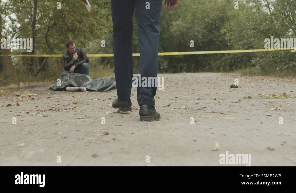 Male Police Officer Arriving at Crime Scene Stock Video Footage - Alamy