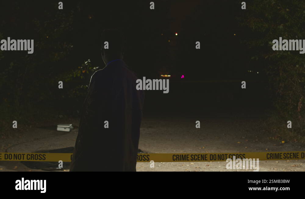 Black Male Police Detective Walking Back and Forth at Murder Scene ...