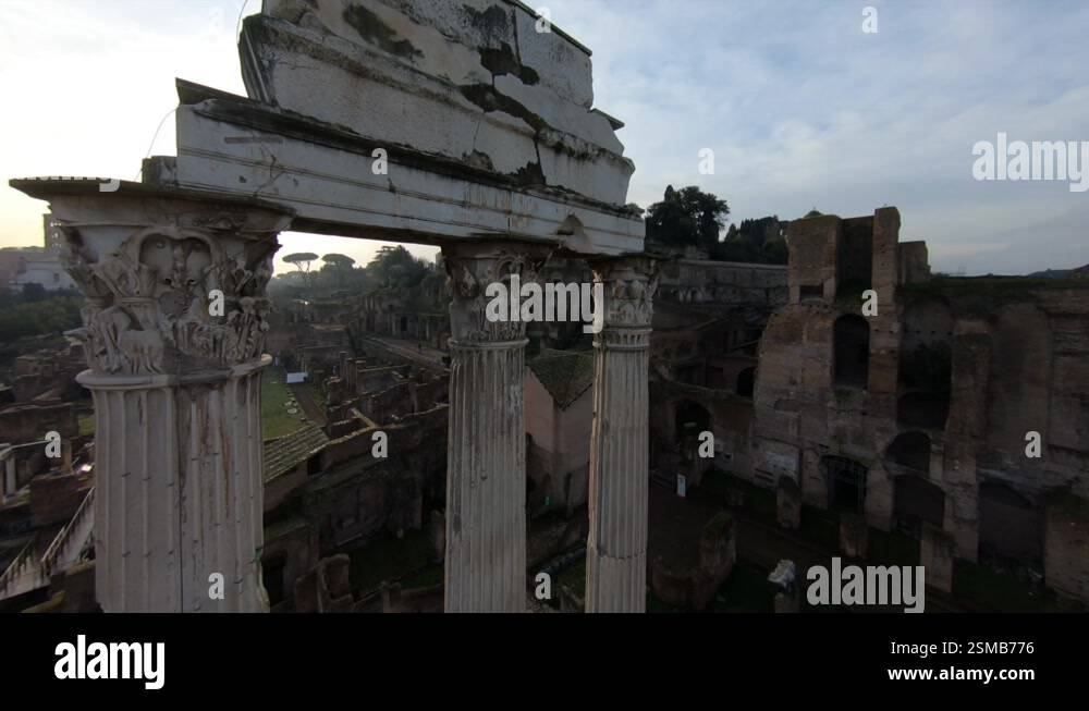 Columns among the remains of Ancient Rome at the Roman Forum. Colosseum ...