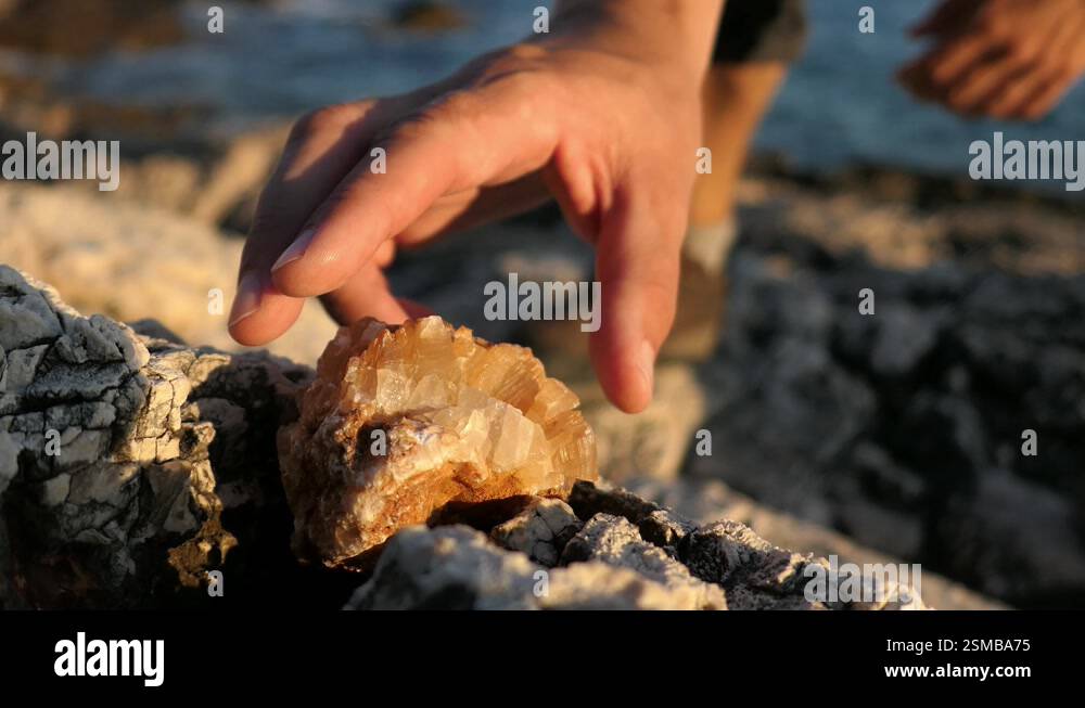Man discovering natural mineral rock crystal, mineralogy finding by the ...