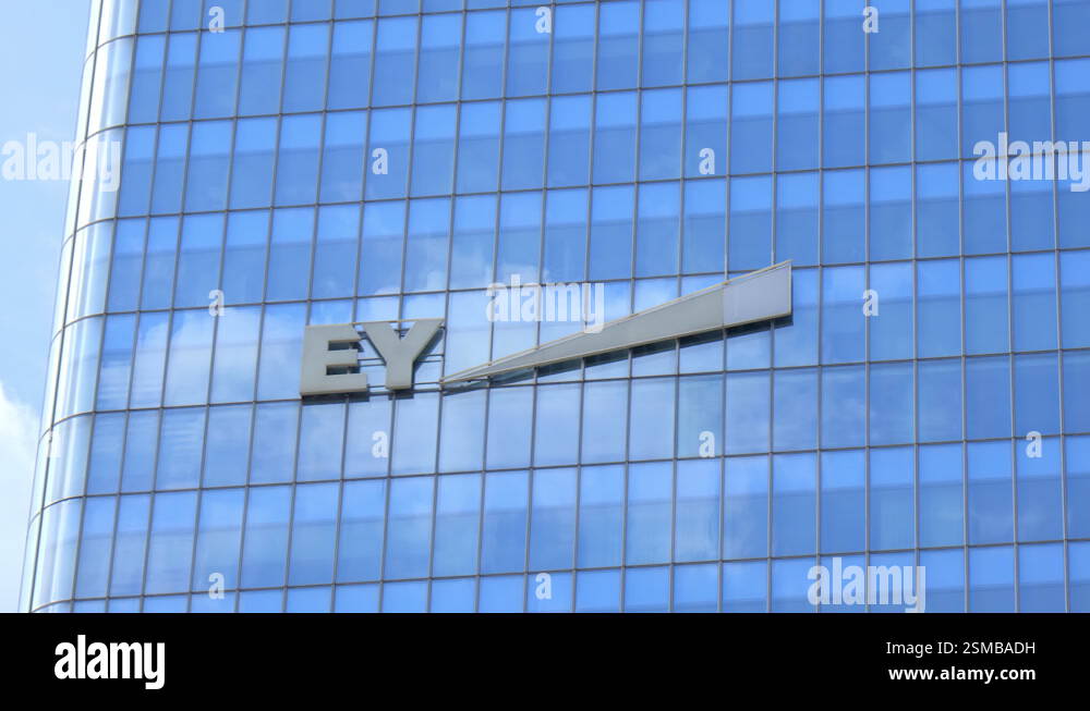 EY sign on the Tour First tower in La Defense business district in ...