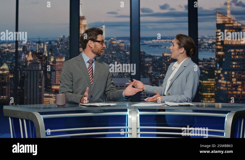 Friendly anchors smiling evening television channel closeup ...