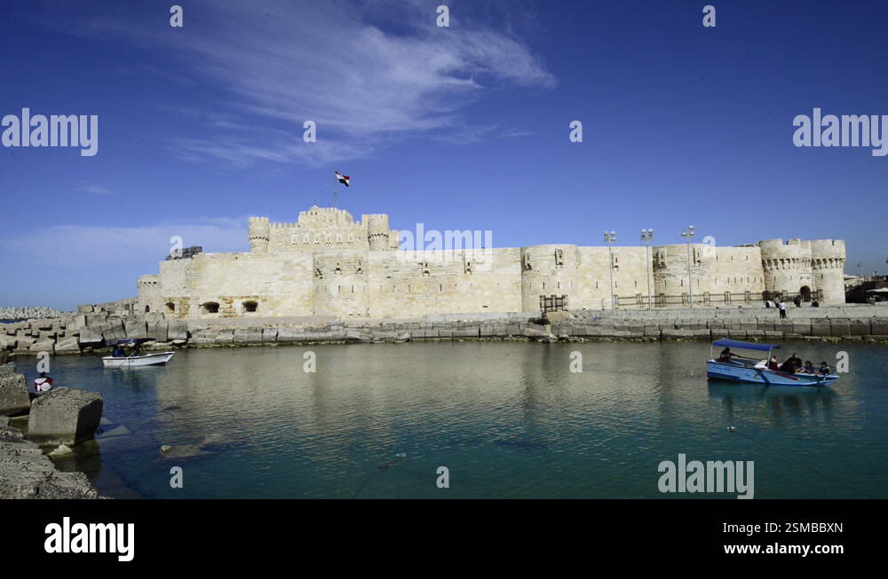 Citadel of Qaitbay in Alexandria, Egypt. Bird passes by. Castle on ...