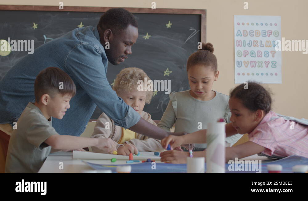 Teacher and Kids Drawing Together on Art Class Stock Video Footage - Alamy