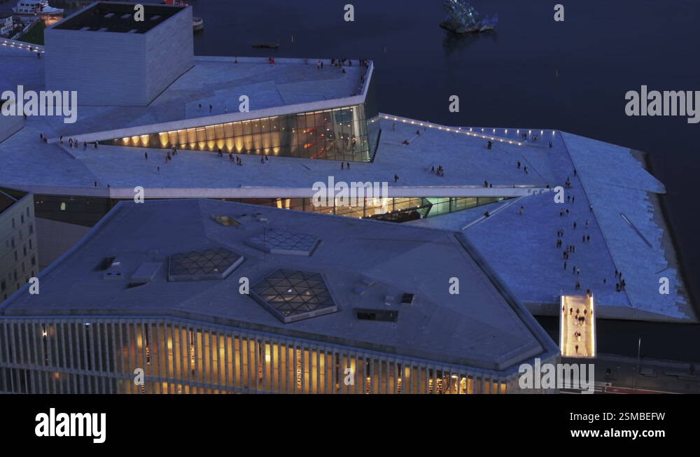 Pedestrians walking on promenade and lookout platform at modern ...