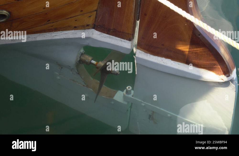 The screw of an old sailing yacht is close-up in the water motionless ...