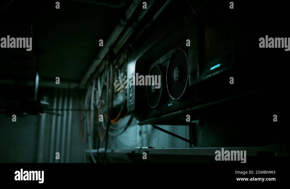 A dark concrete interior with a ceiling fan and multiple wires hanging ...