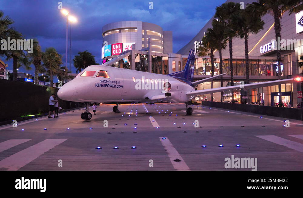 Exhibit of life-size replica of an airplane set outside of a mall.on a ...