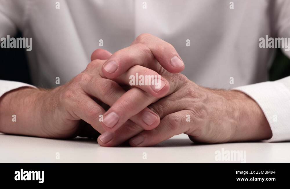 nervous man hands folded in lock closeup. gestures hands man in nervous ...