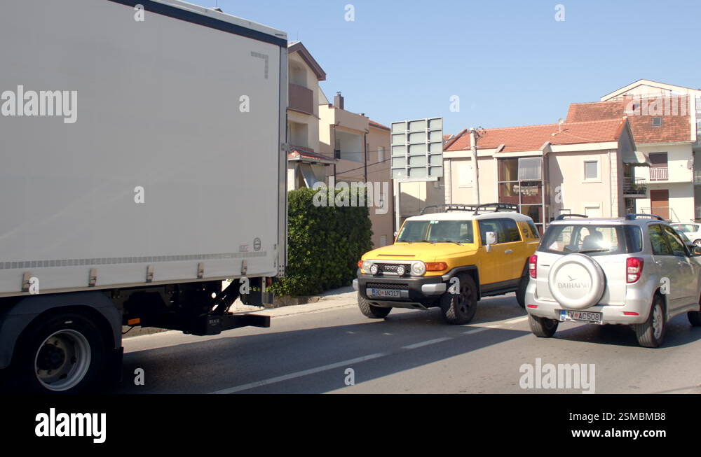 The movement of vehicles. Trucks transporting goods and commercial ...