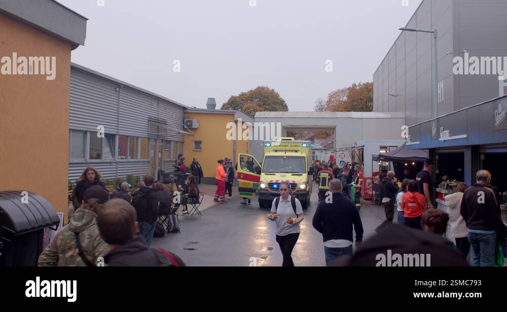 Arrival of an ambulance at a public event is a critical situation Stock Video Footage - Alamy